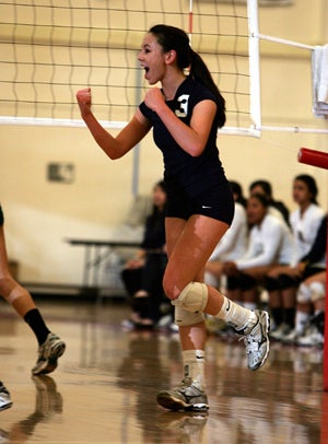Valley Christian's Rachel Alvey has fun on the volleyball court
